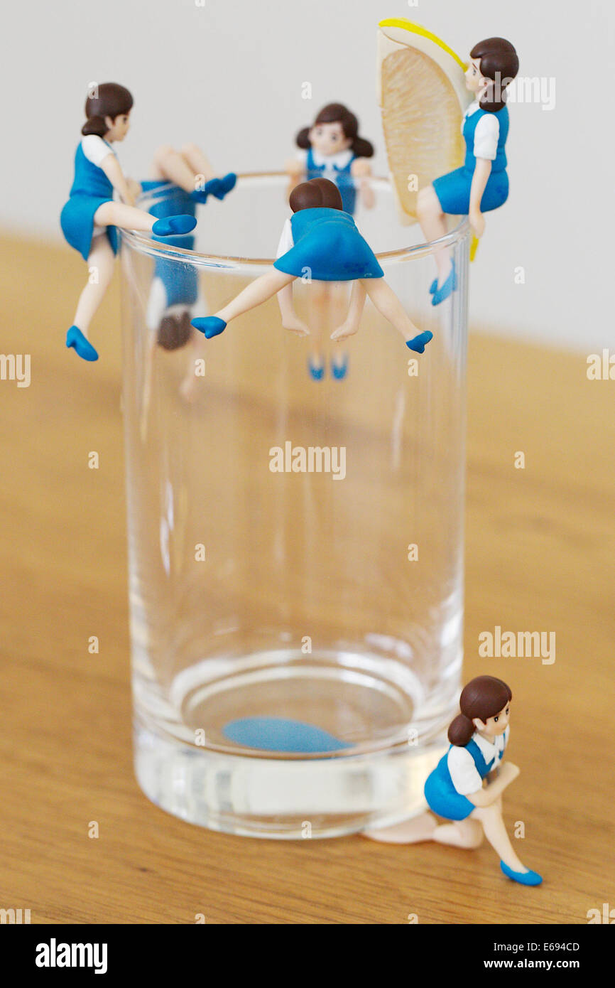 Different kinds of "Cup no Fuchiko" climb on the side of a glass on ...