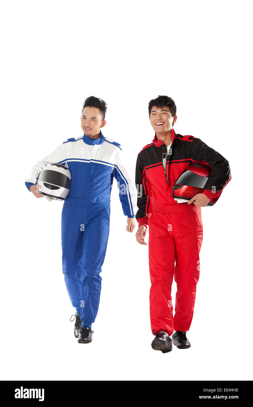 Standing side by side looking away smiling race car driver hi-res stock ...
