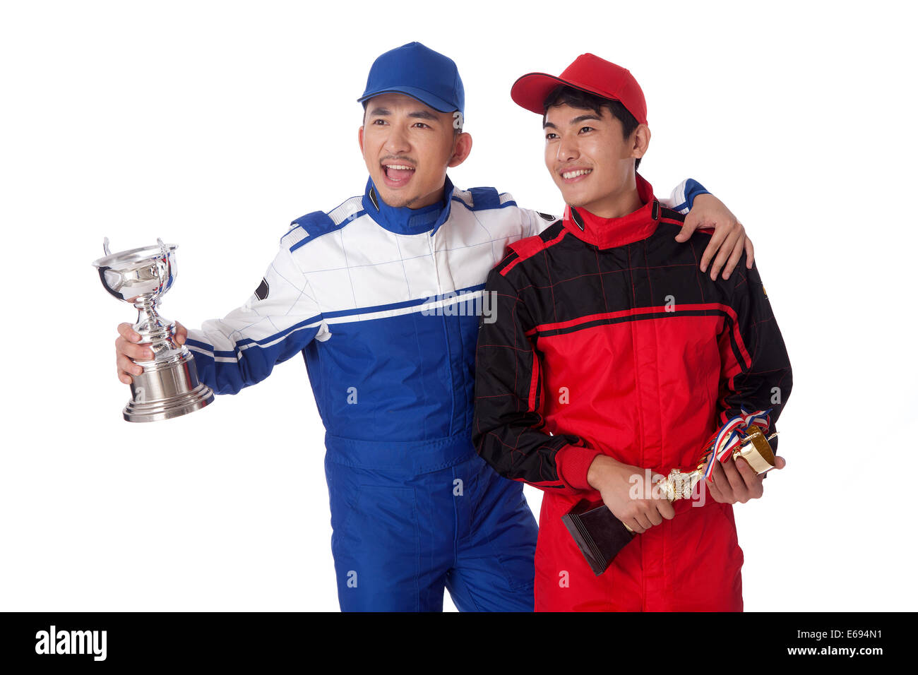 Standing side by side looking away smiling race car driver hi-res stock ...