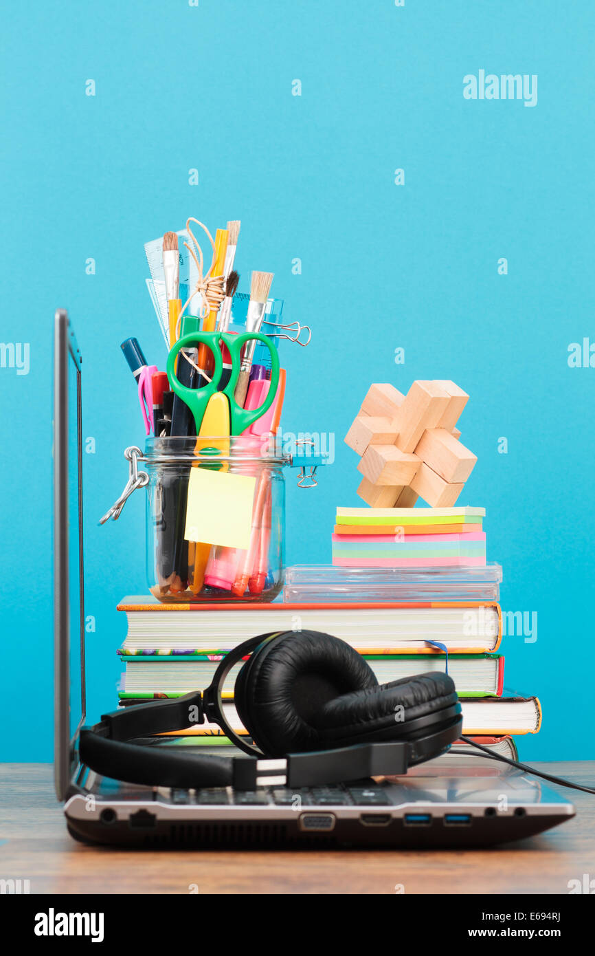 School accessories on desktop with blank blue background Stock Photo ...