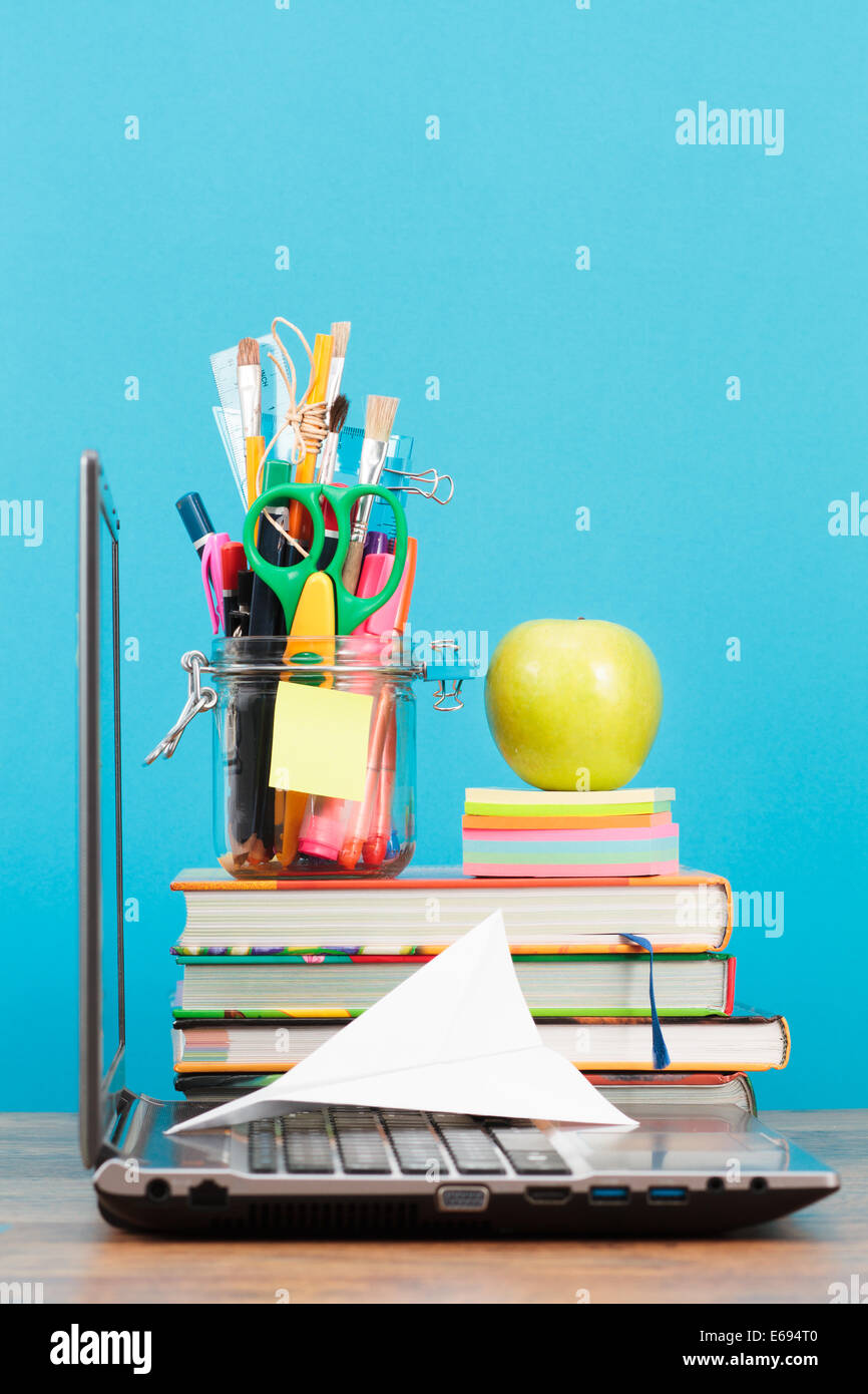 School accessories on desktop with blank blue background Stock Photo ...