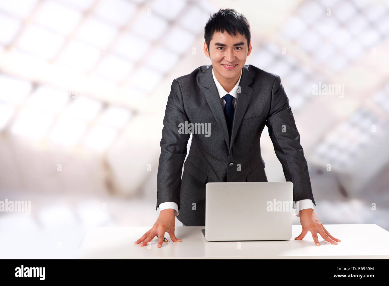 Young businessman using laptop Stock Photo - Alamy