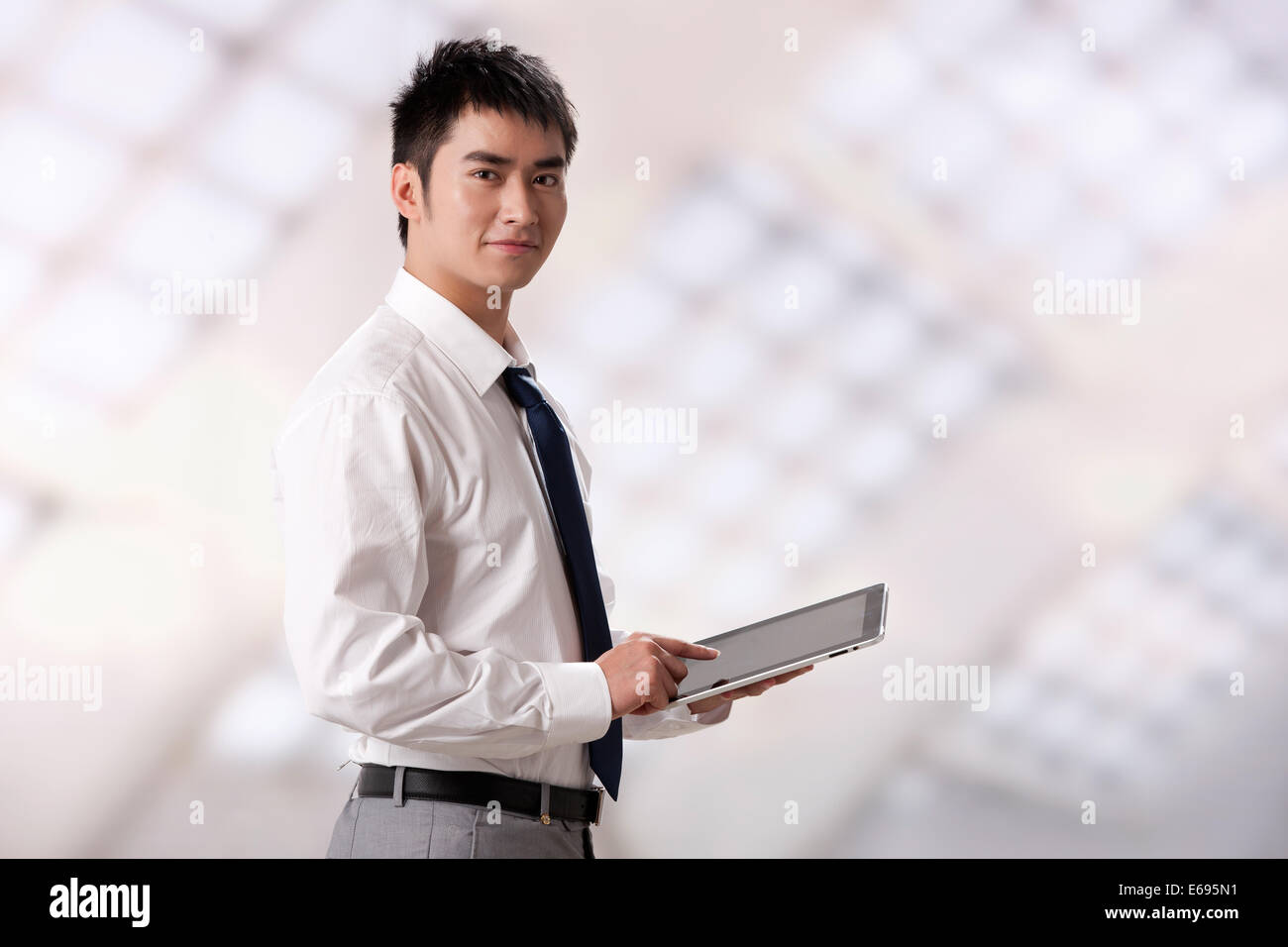 Young businessman using laptop Stock Photo - Alamy