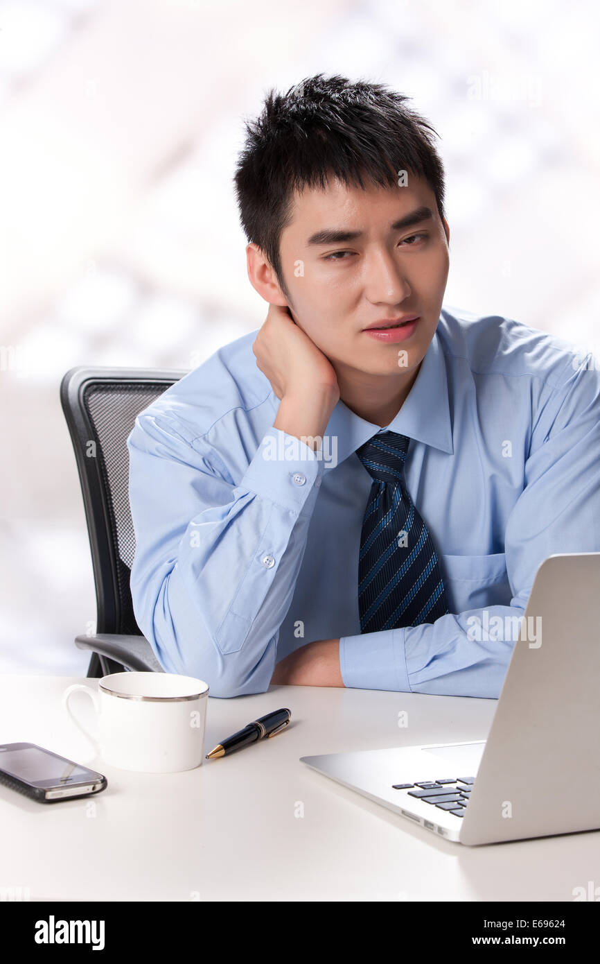 Young businessman using laptop Stock Photo - Alamy