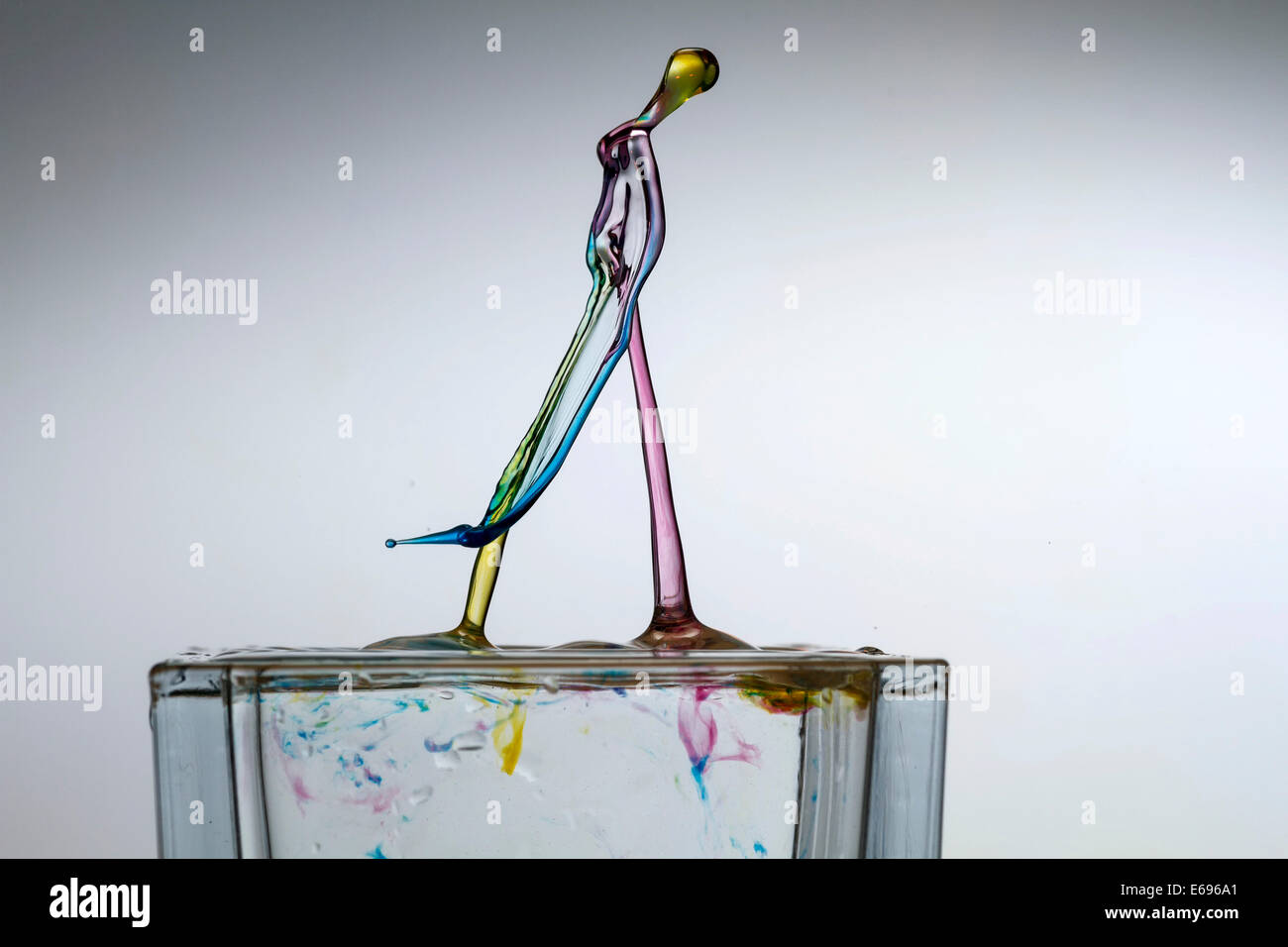 Three different coloured drops colliding Stock Photo - Alamy