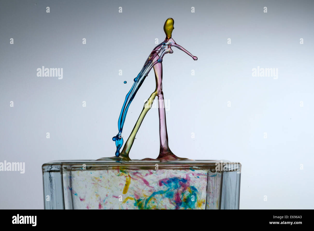 Three different coloured drops colliding Stock Photo - Alamy