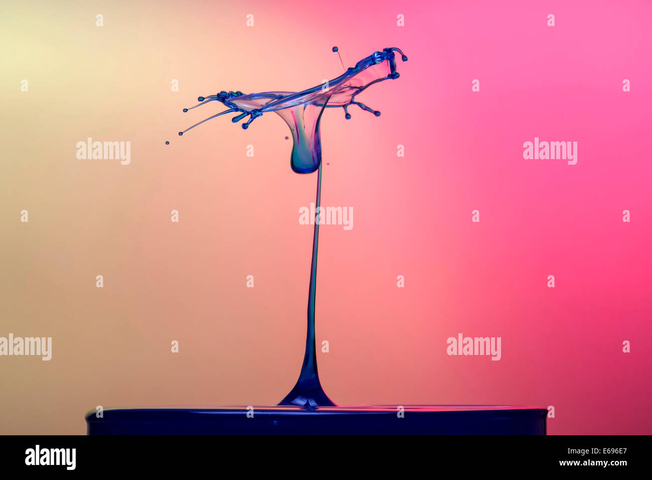 Two drops colliding Stock Photo - Alamy
