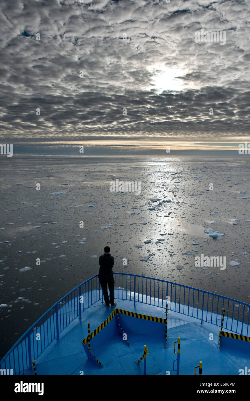 Expedition ship sailing through ice floes, edge of pack ice, Arctic ...
