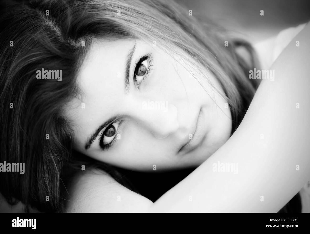 Head resting on arms hi-res stock photography and images - Alamy