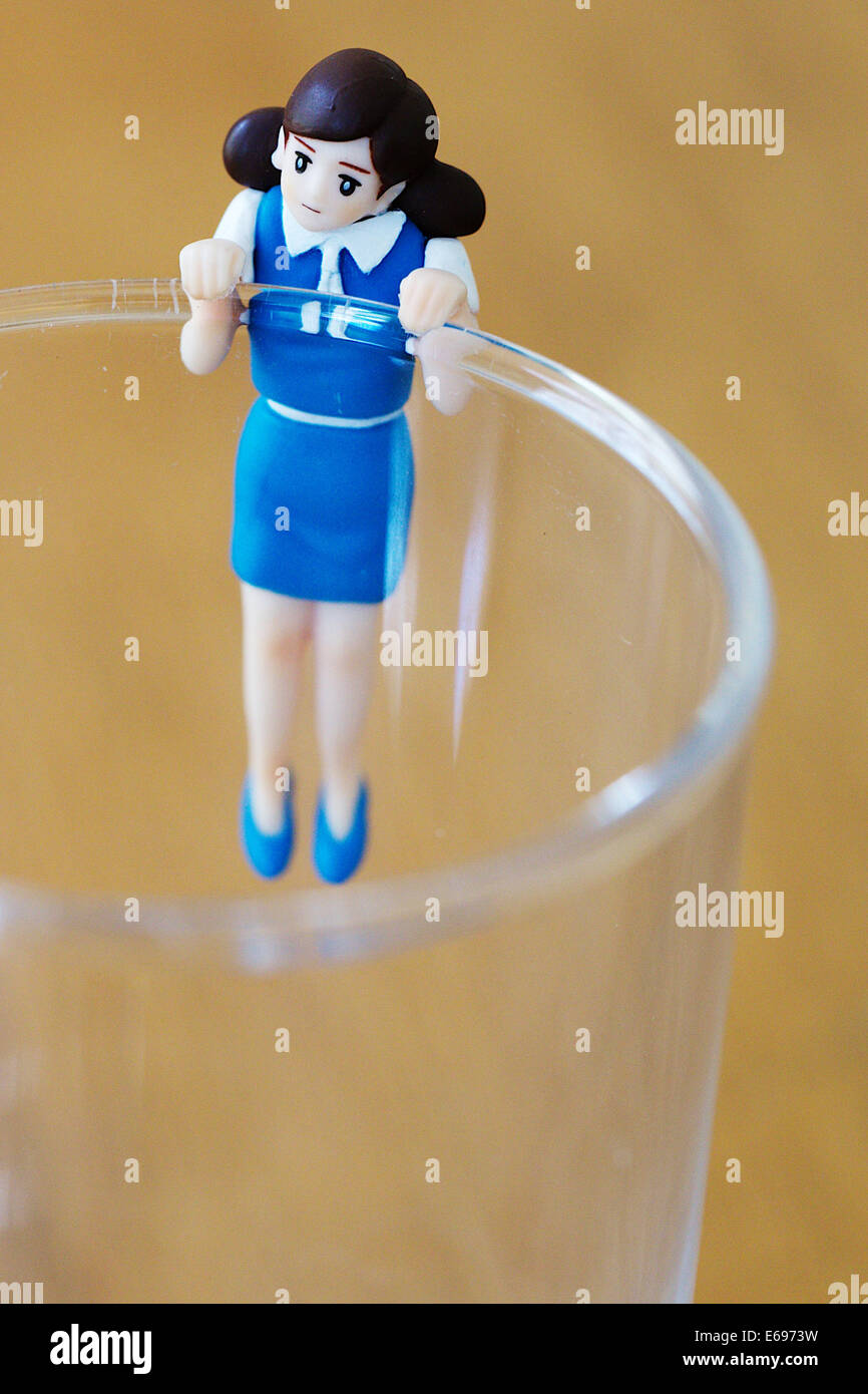 A figure of "Cup no Fuchiko" climbs on the side of a glass on August 19 ...