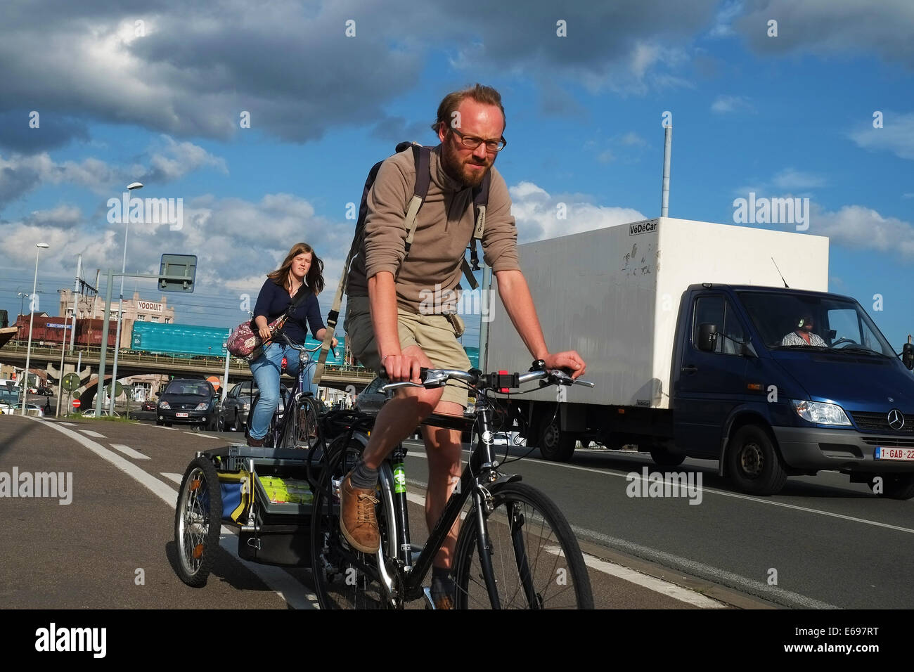 Cyclists om a busy road Stock Photo - Alamy