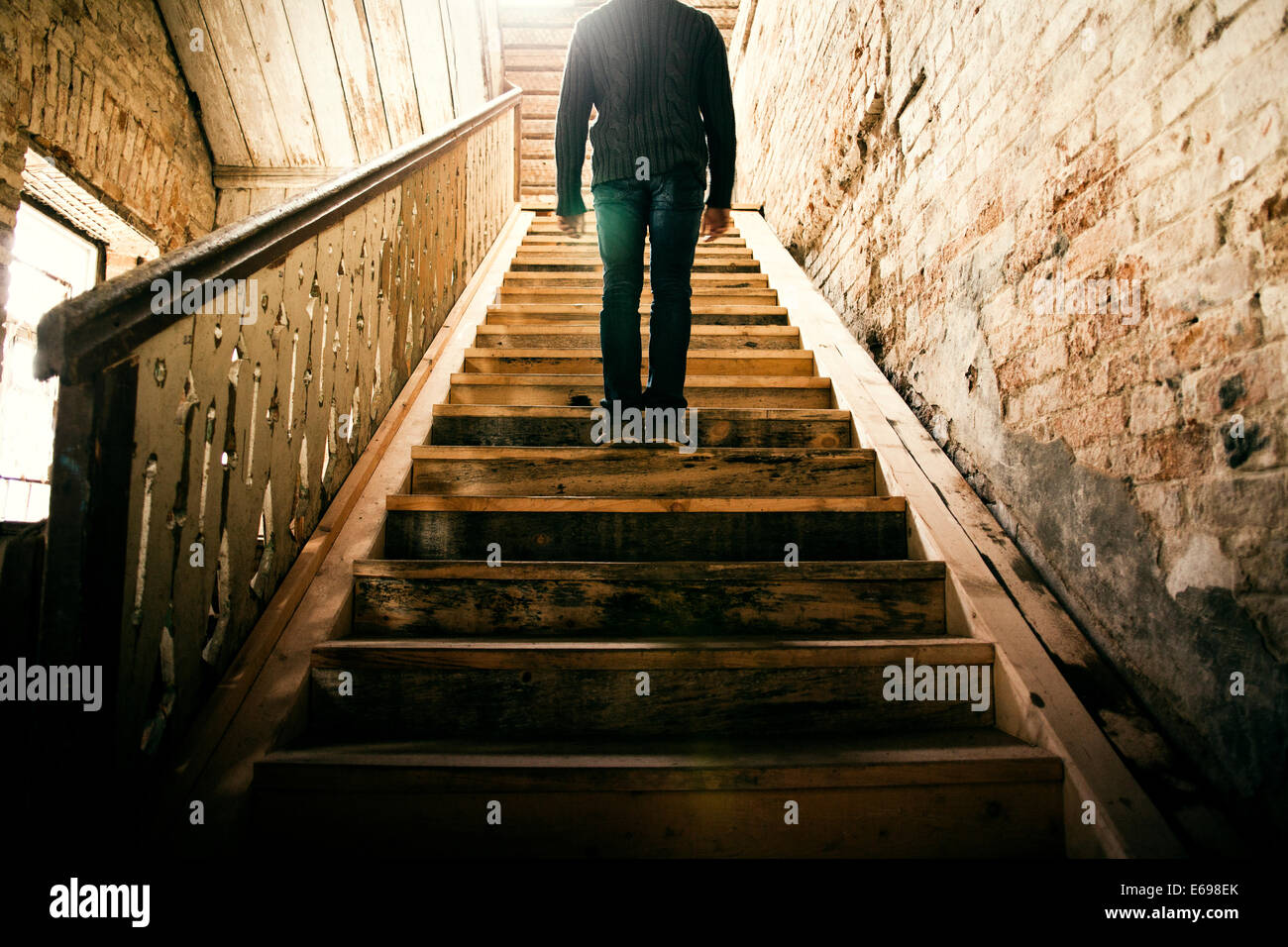 Man standing on stairs hi-res stock photography and images - Alamy