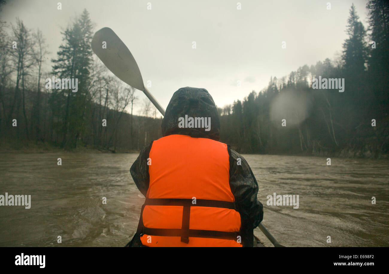 Mari man kayaking on river Stock Photo - Alamy