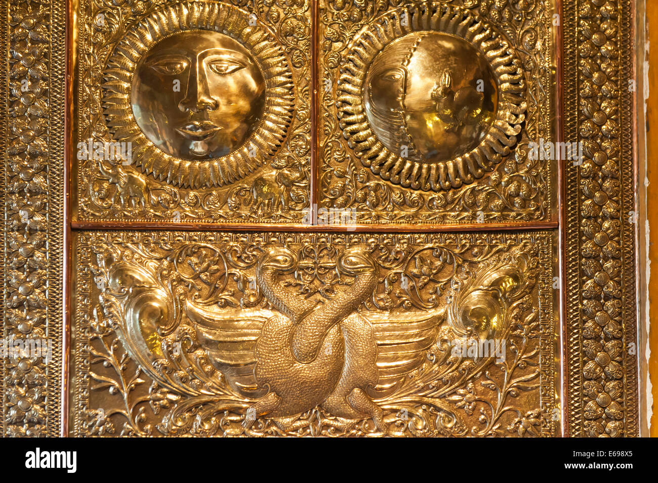 Buddhist symbols, sun, moon and two peacocks, gilded portal to the ...