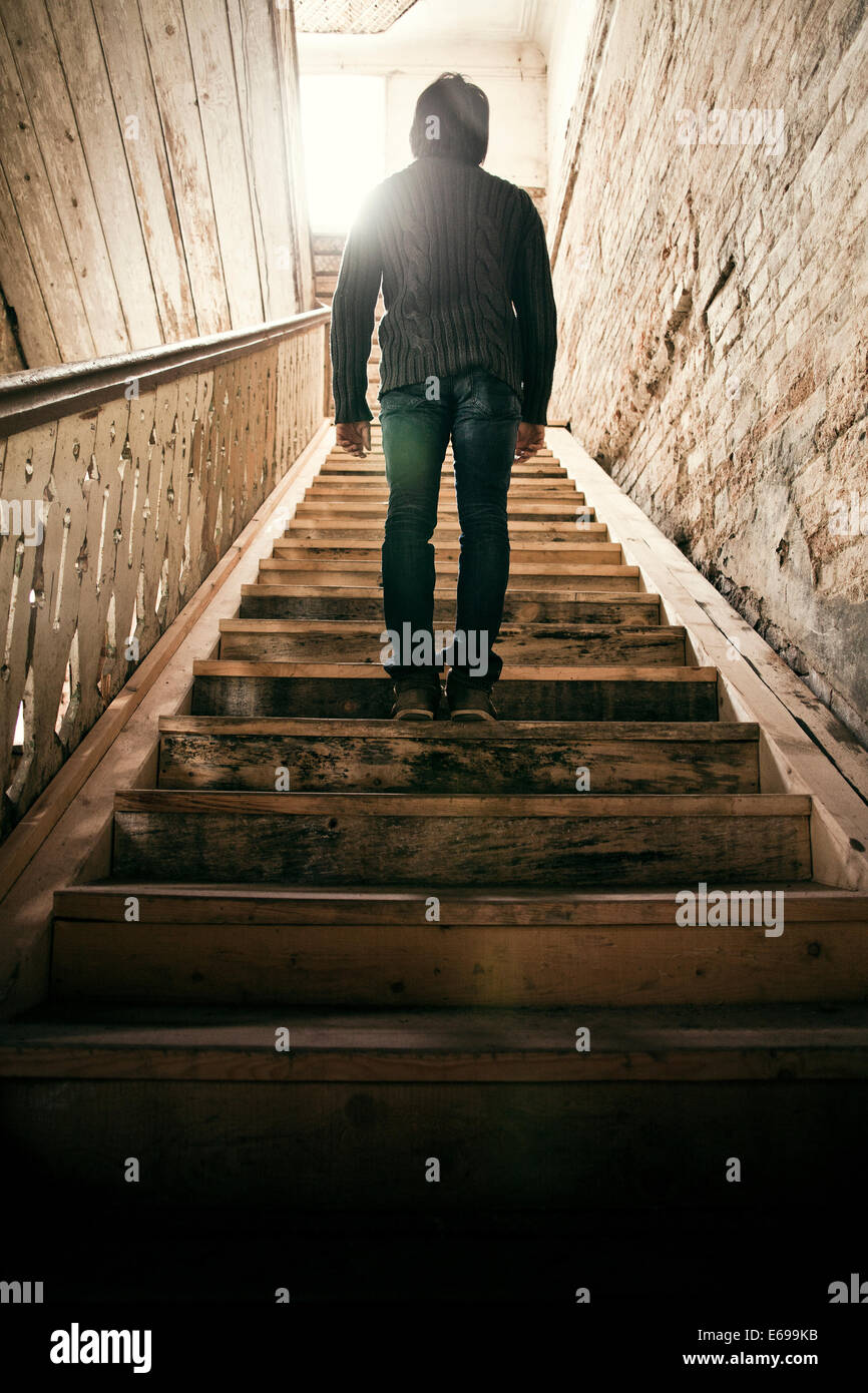 Mari man standing on staircase Stock Photo - Alamy