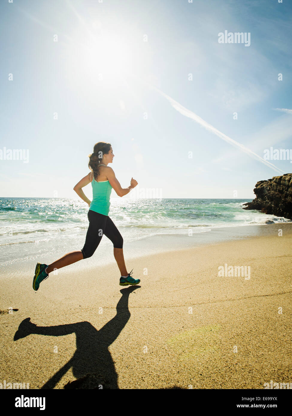 Woman running beach hi-res stock photography and images - Alamy
