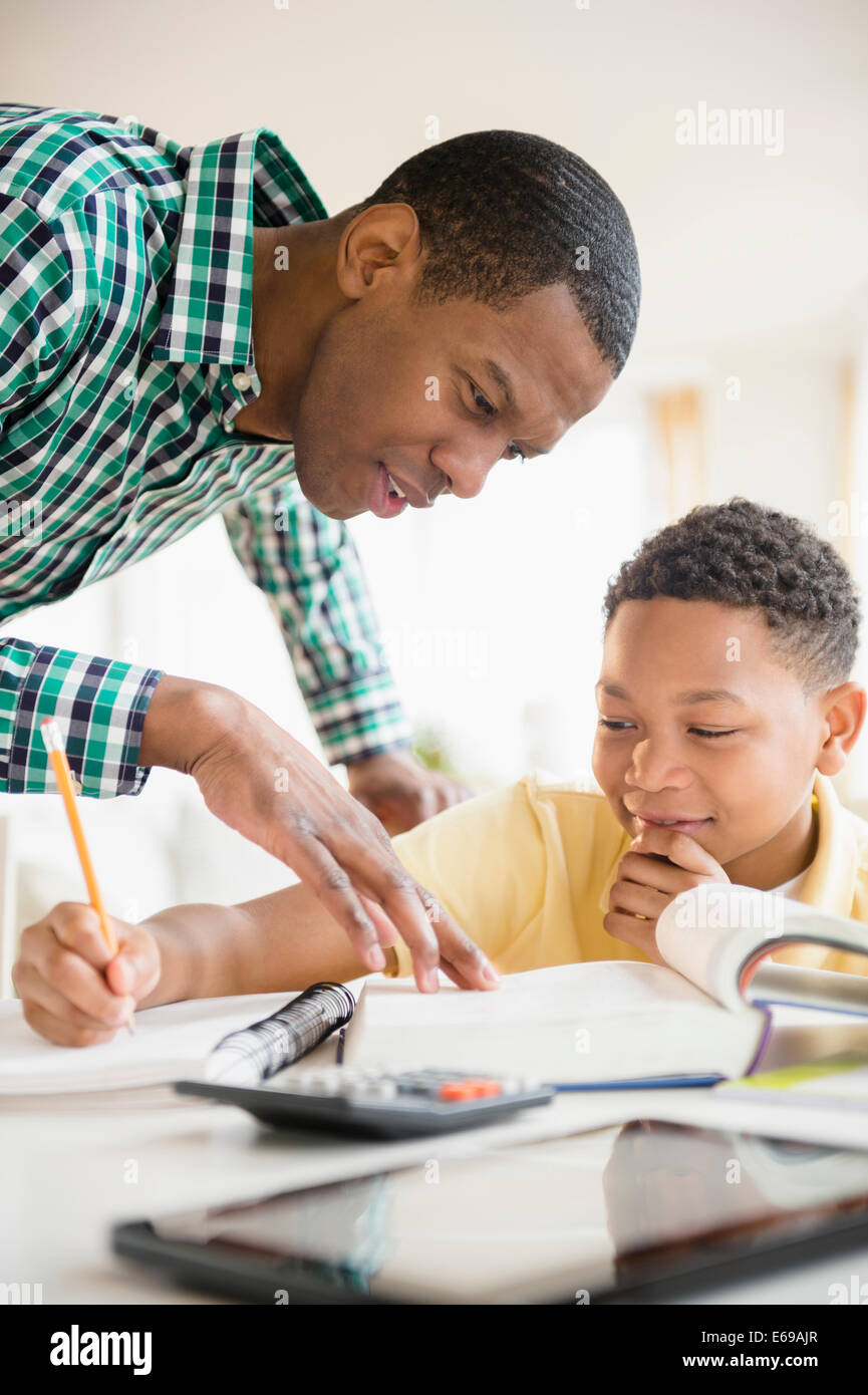 Father helping son with homework Stock Photo - Alamy Father helping son with homework Stock Photo - Alamy