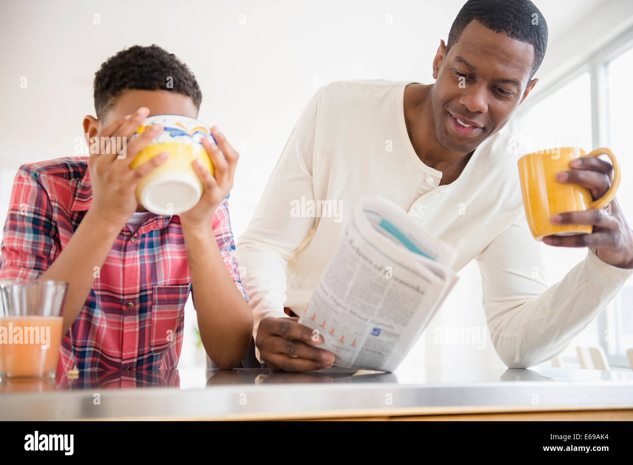 Child breakfast newspaper hi-res stock photography and images - Alamy