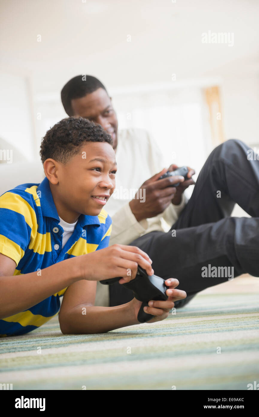 Child father using video online hi-res stock photography and images - Alamy