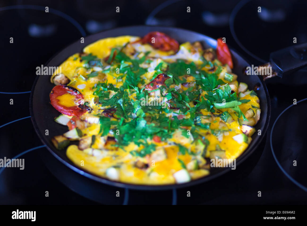 Cooking scrambled eggs omelet vegetables hi-res stock photography and ...