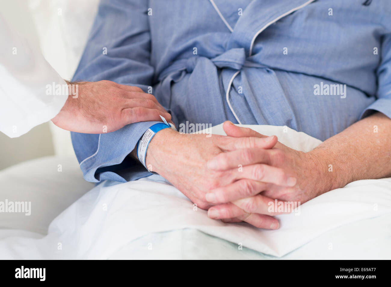 Caucasian doctor reassuring patient in hospital Stock Photo - Alamy
