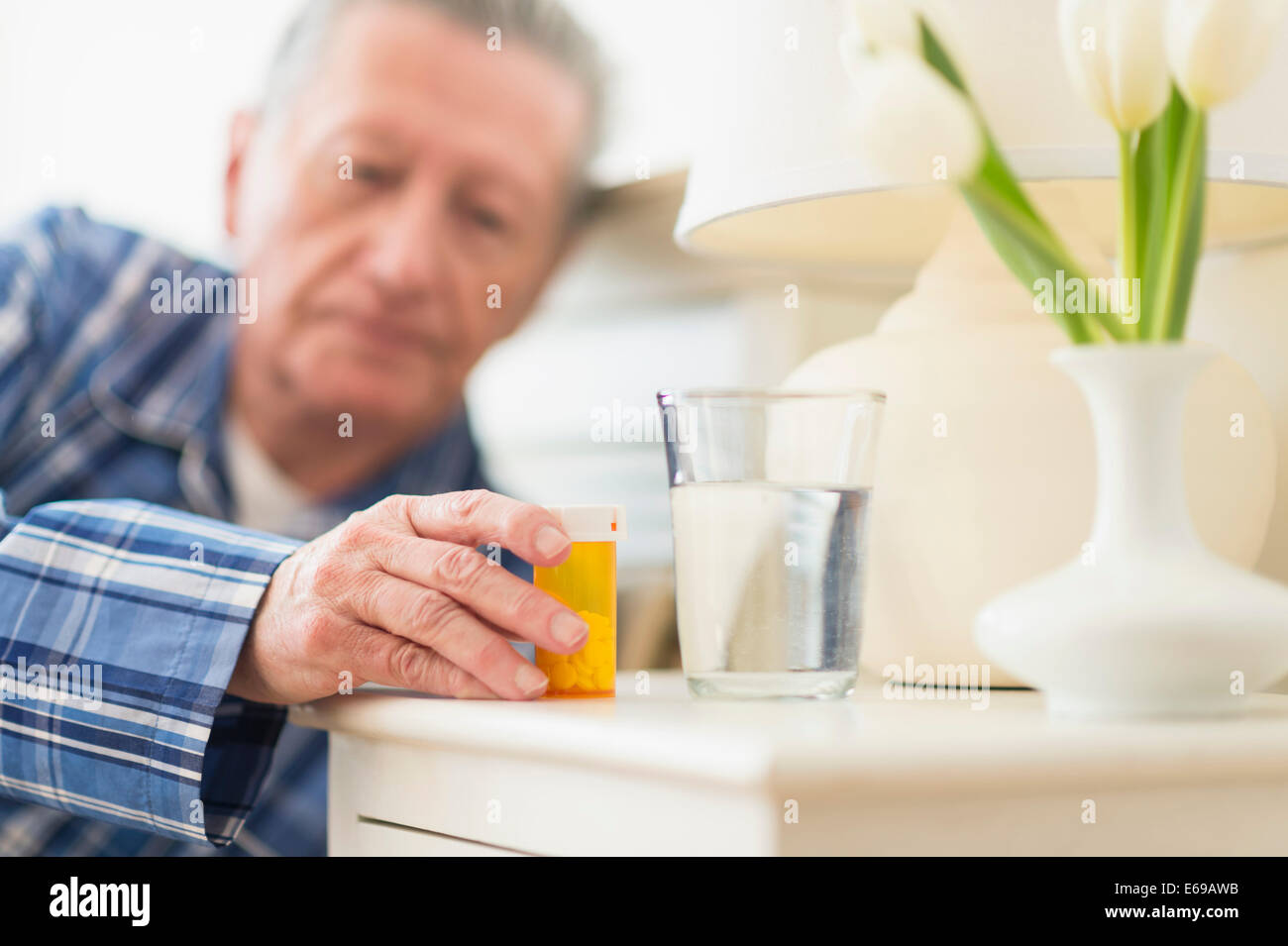 Taking medication man hi-res stock photography and images - Alamy