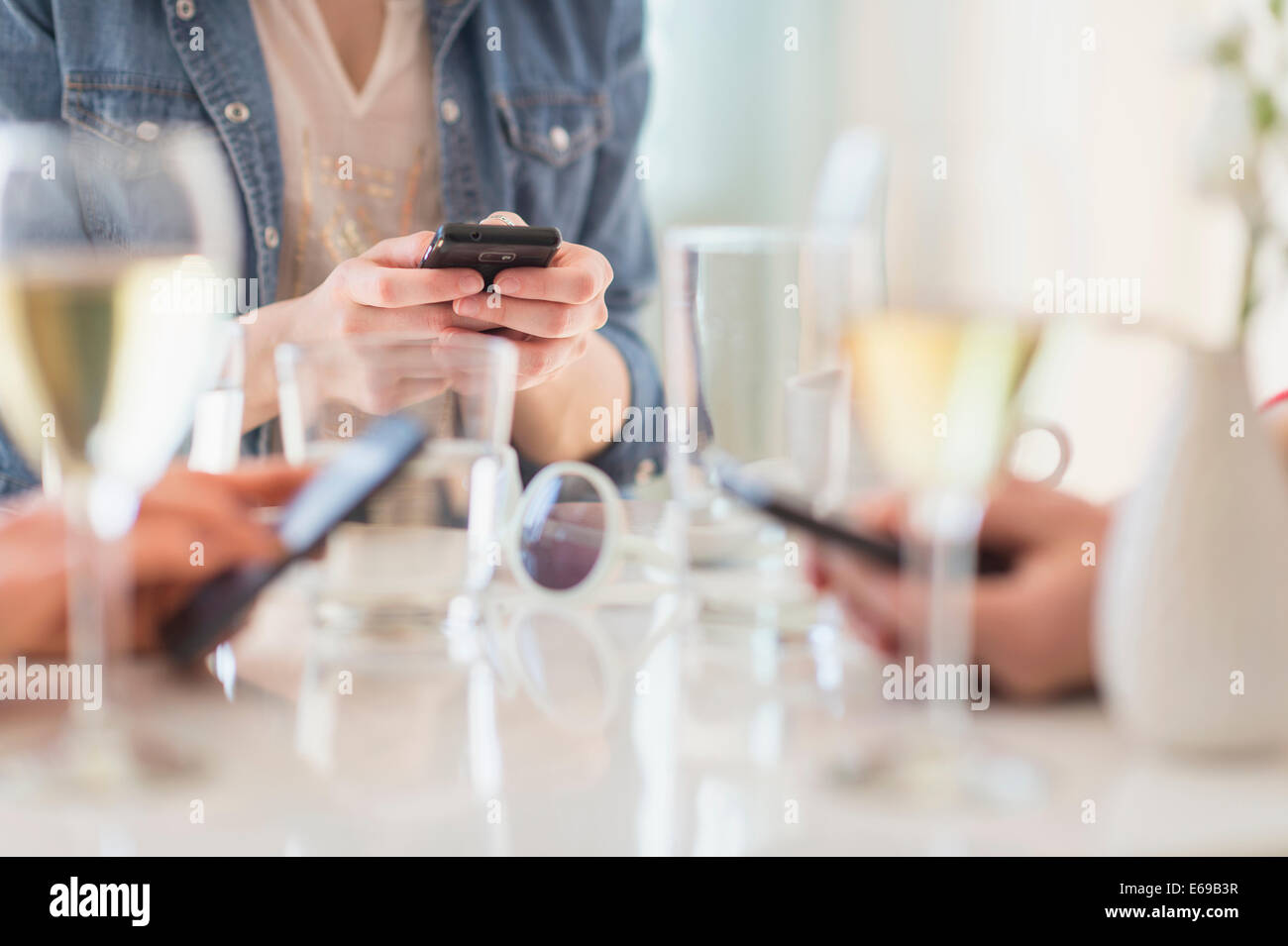 Texting at dinner table hi-res stock photography and images - Alamy
