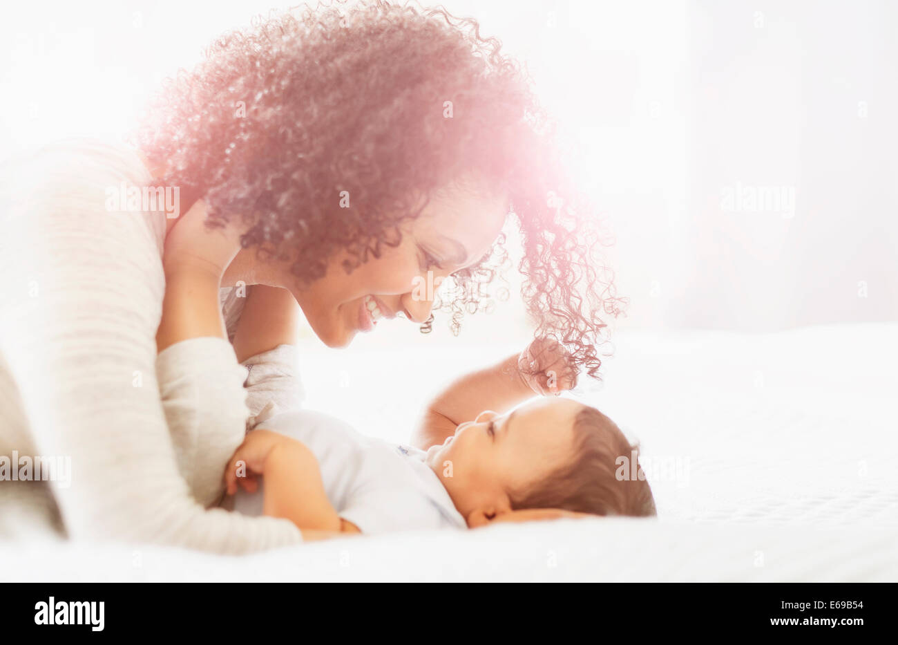 Mixed race mother admiring baby Stock Photo - Alamy