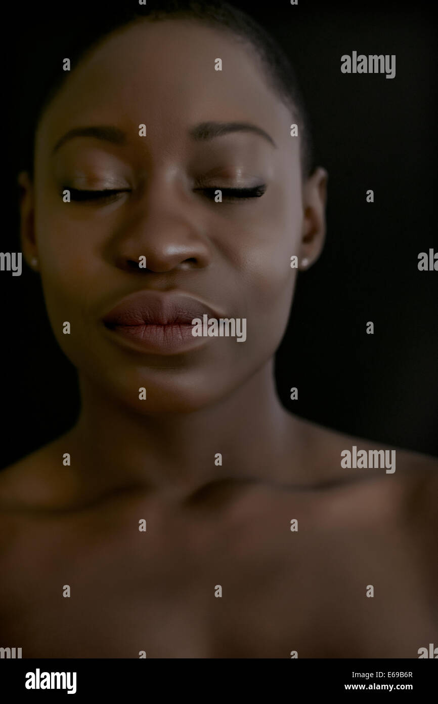 Black woman with eyes closed Stock Photo - Alamy