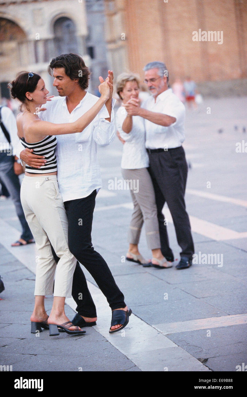Couples dancing in town square Stock Photo - Alamy