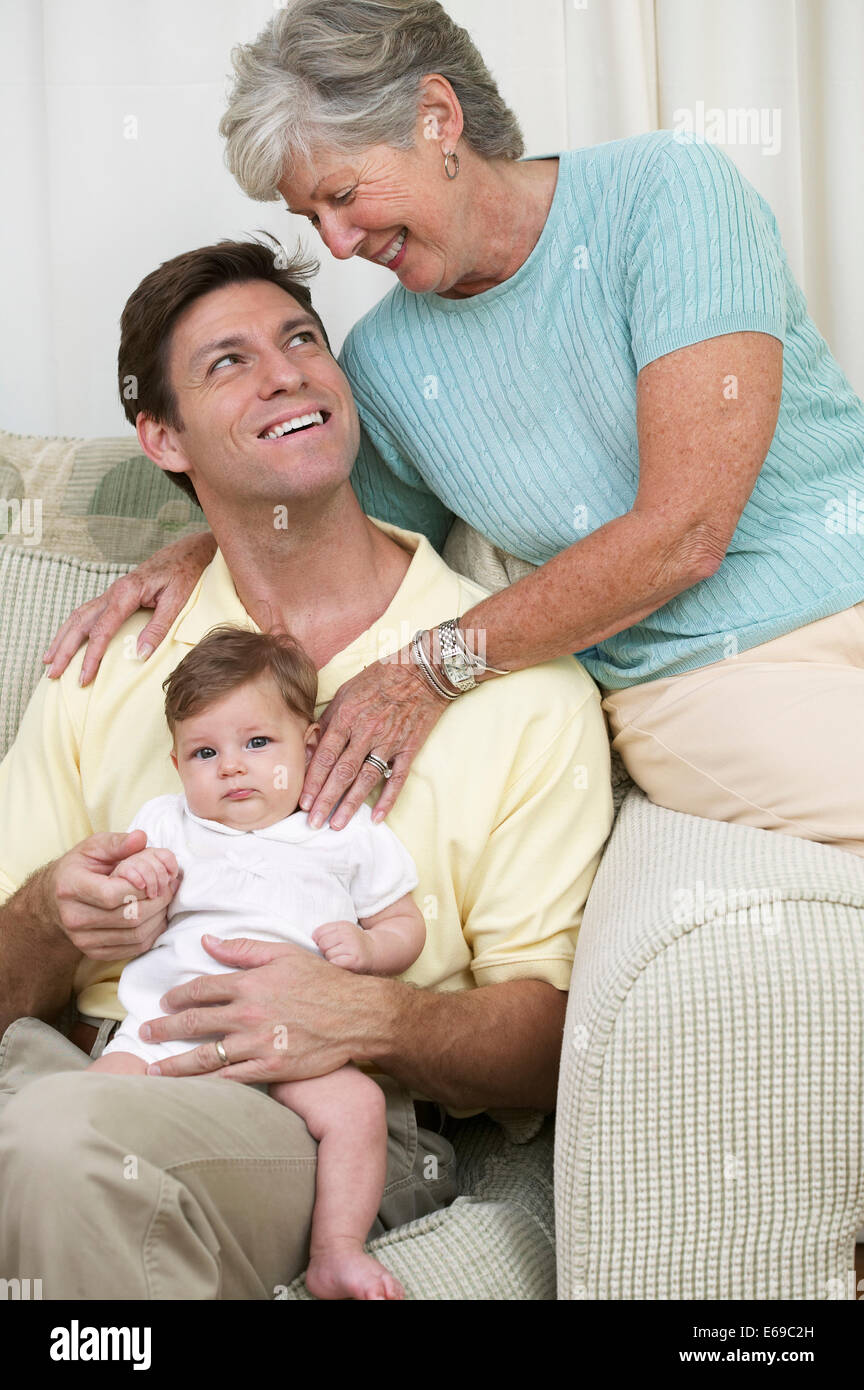 Three generations of family on sofa Stock Photo - Alamy