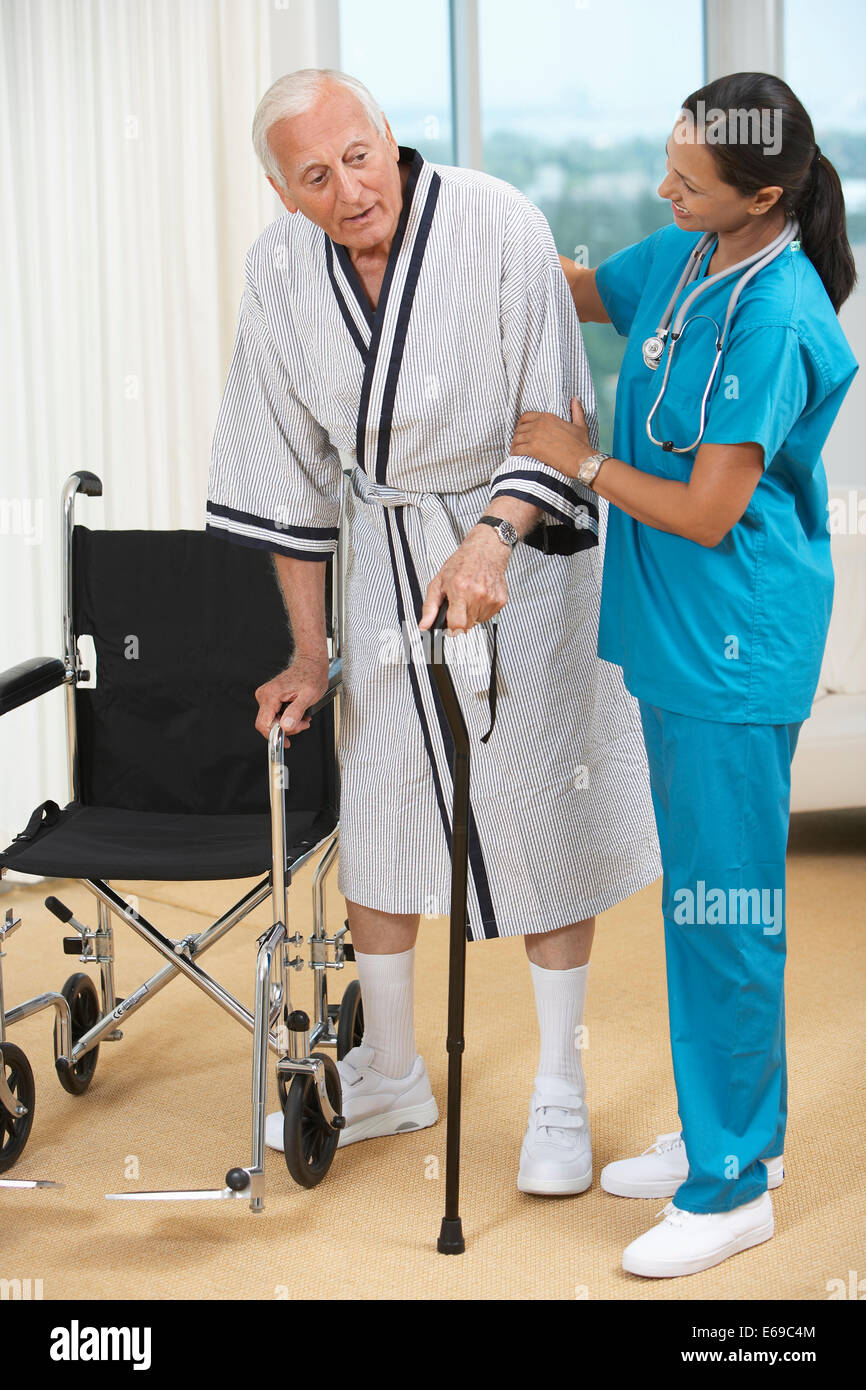 Assisting senior woman cane hi-res stock photography and images - Alamy