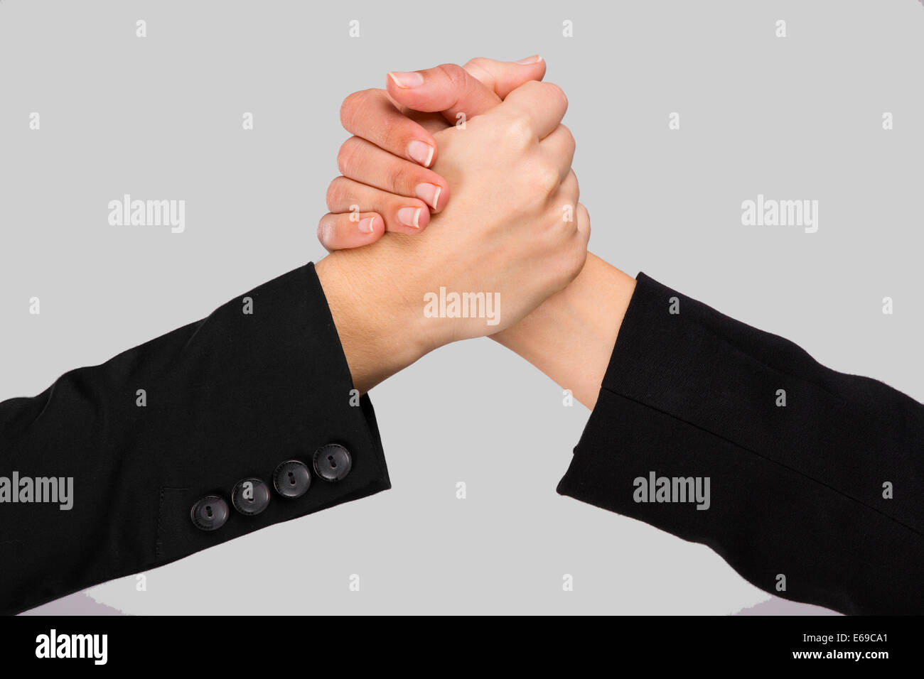 Greeting hands over a gray background Stock Photo - Alamy