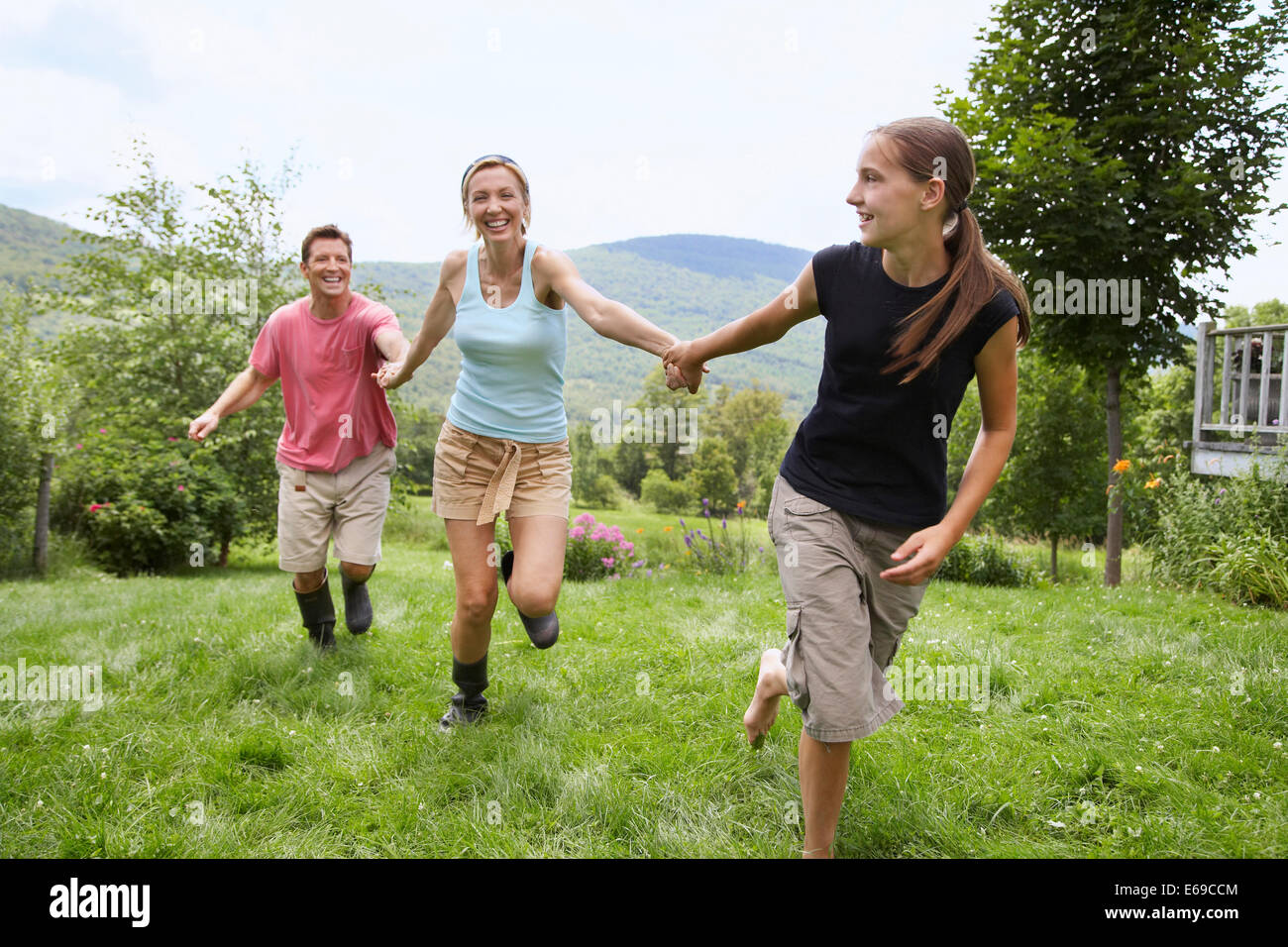 Family walking together in backyard Stock Photo - Alamy