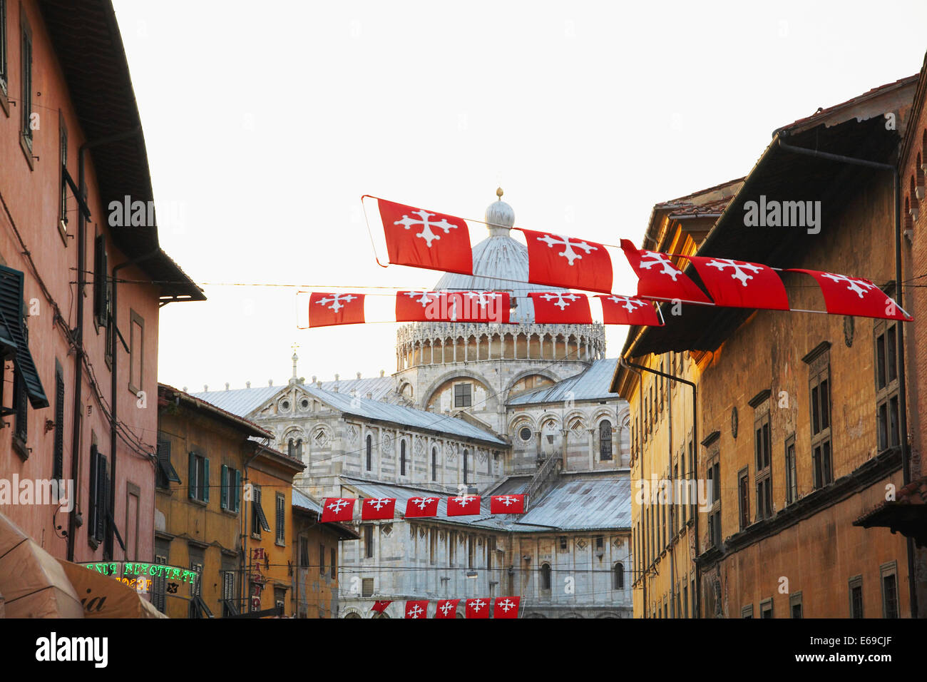 Flags flying over city street, Pisa, Toscano, Italy Stock Photo - Alamy