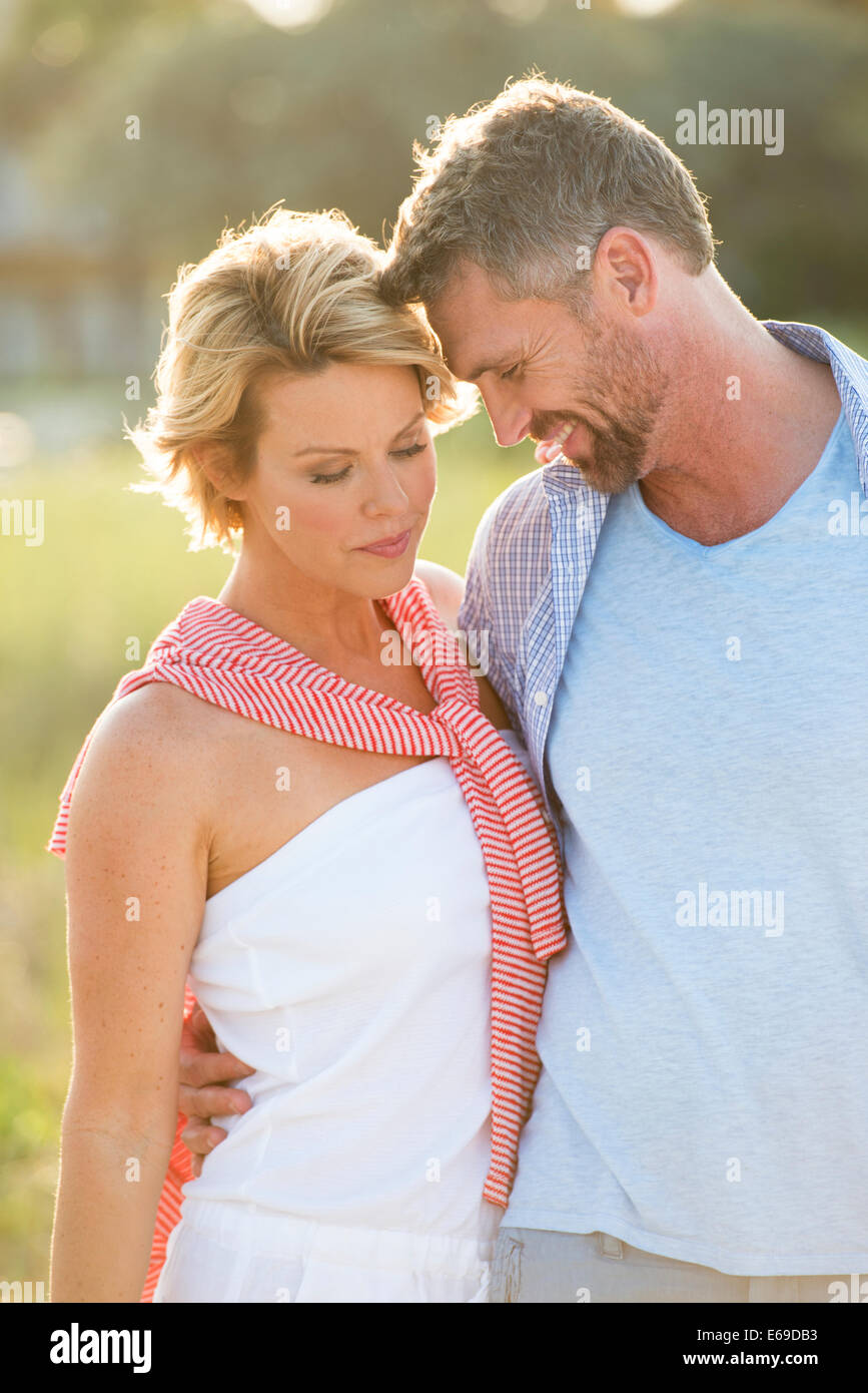 Caucasian couple hugging Stock Photo - Alamy