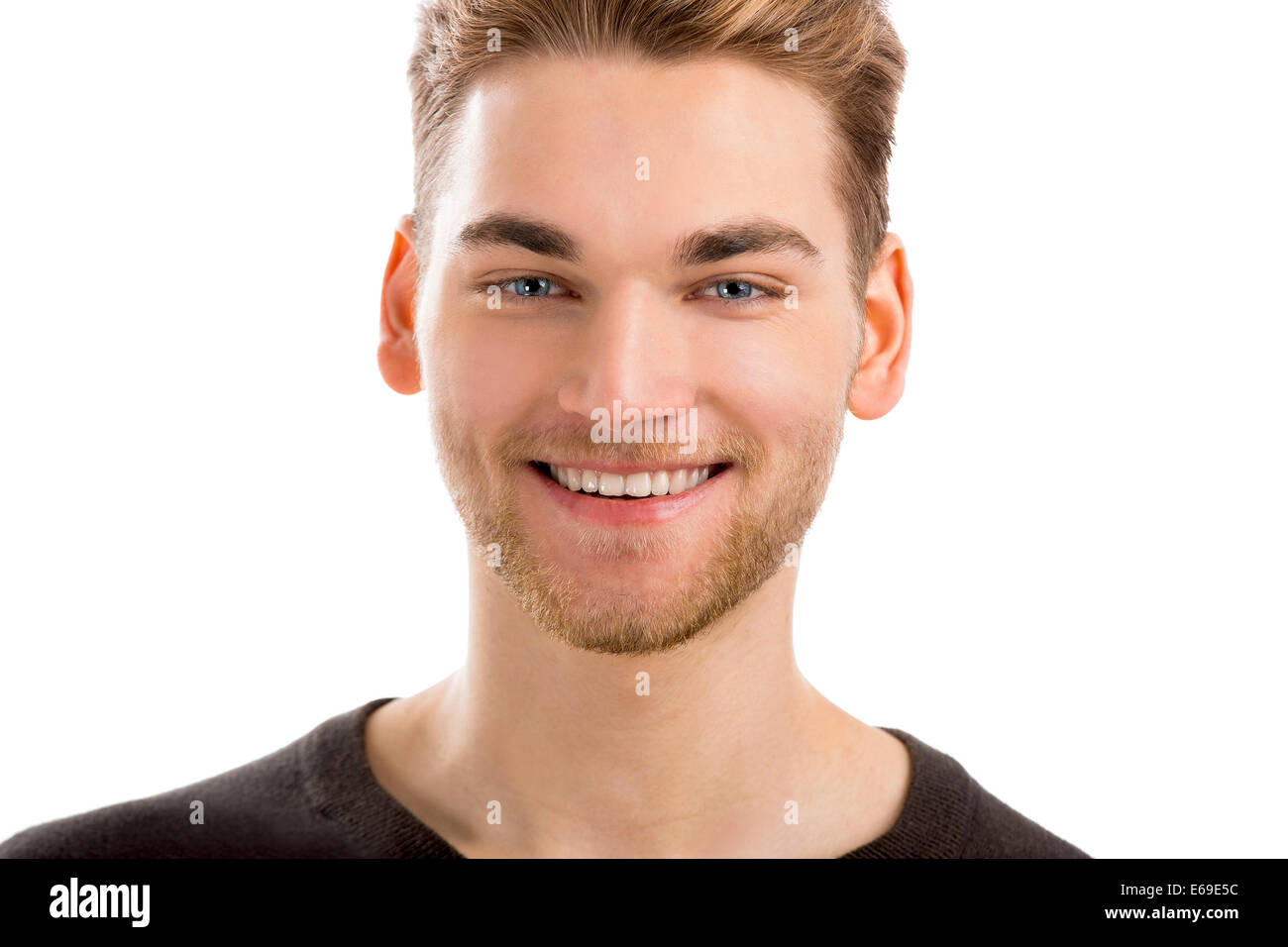 Good looking young man smiling and looking to the camera, isolated on ...