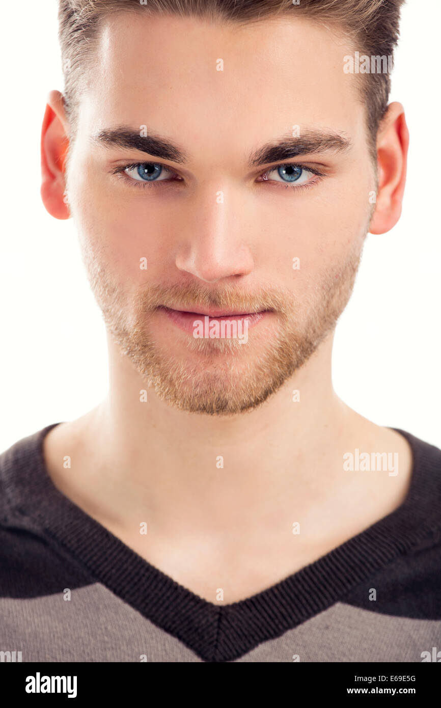 Good looking young man smiling and looking to the camera, isolated on ...