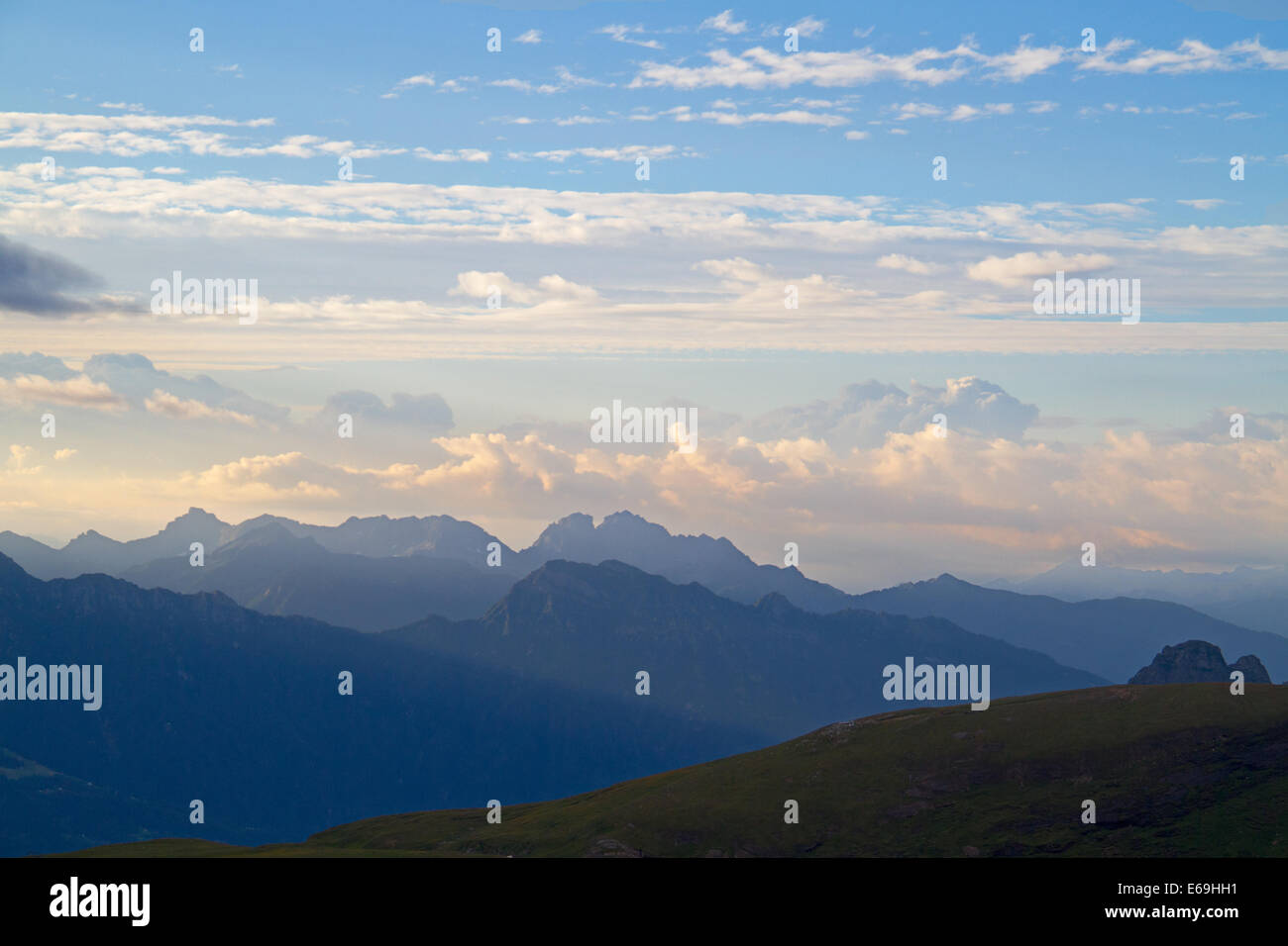 Overlapping mountain ridges in several shades of blue at sunrise Stock ...