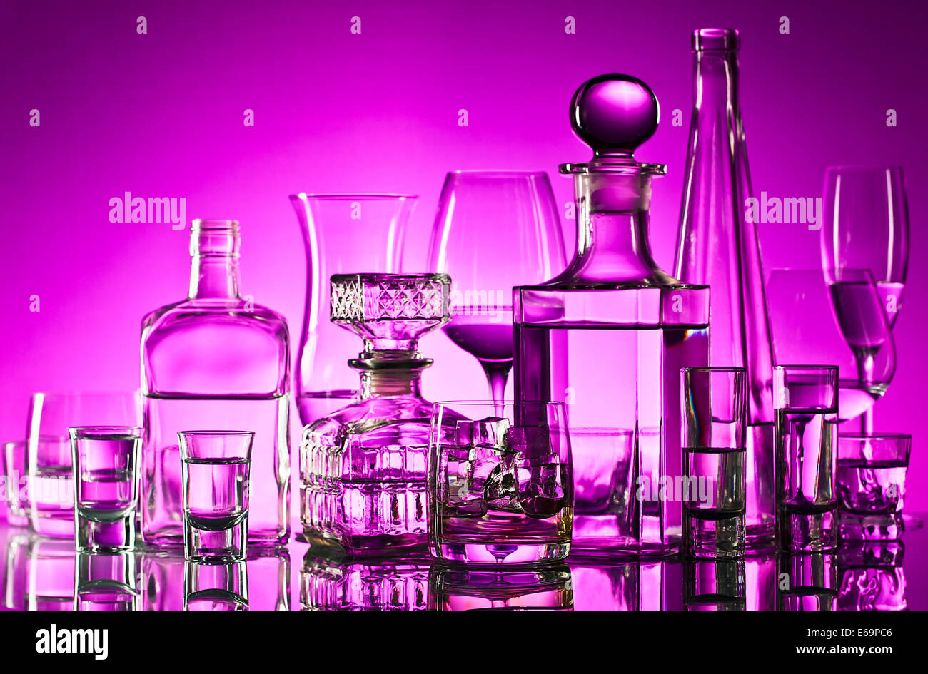alcoholic drinks in bar on glass table Stock Photo - Alamy