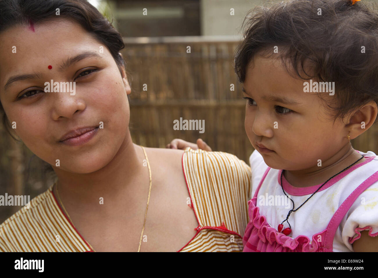 Indian mother and daughter hugging hi-res stock photography and images - Alamy