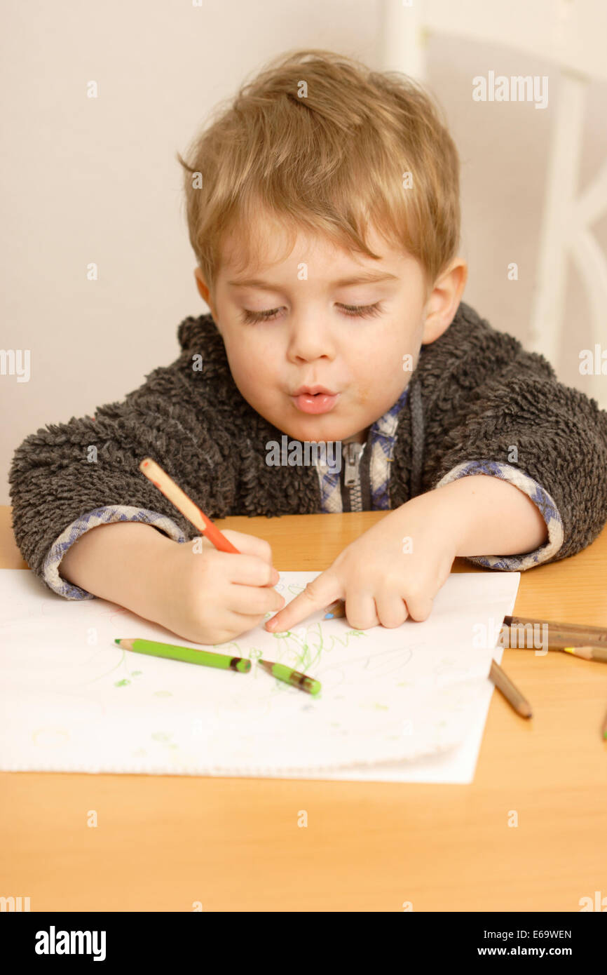 Boy Using Crayons High Resolution Stock Photography and Images - Alamy