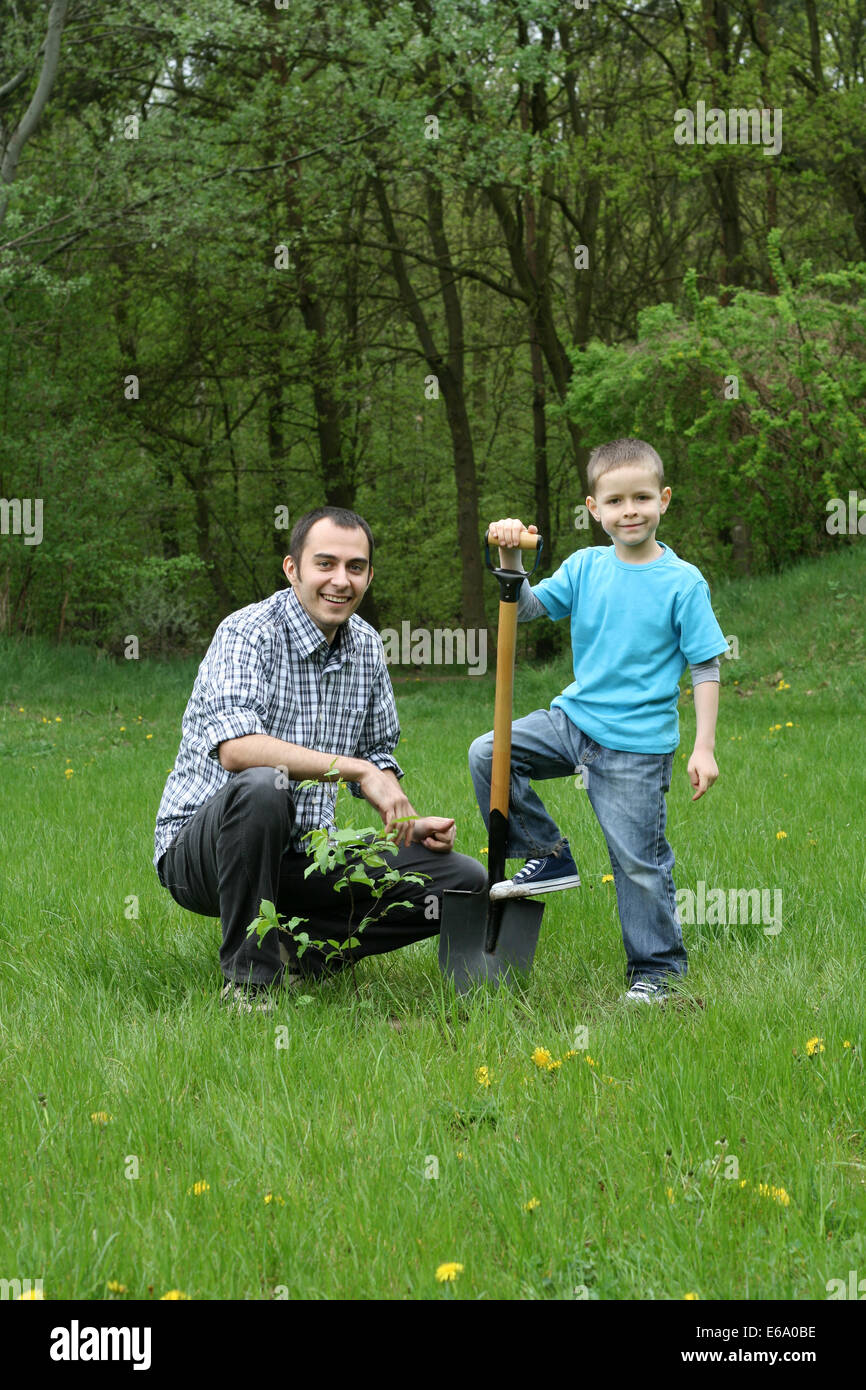 Father son planting tree together hi-res stock photography and images ...