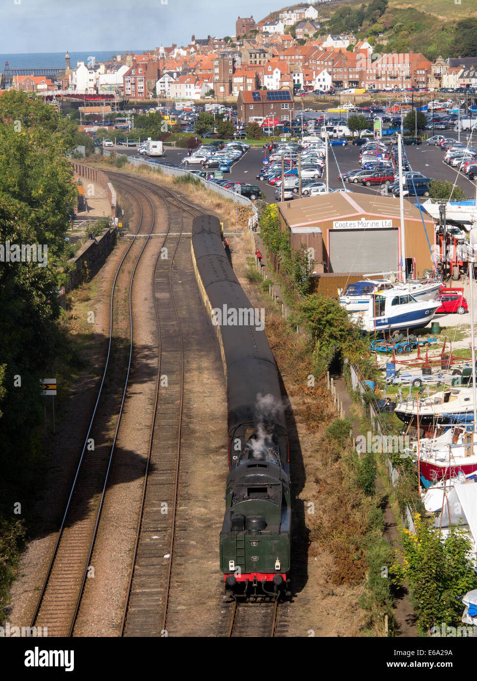 Whitby harbour and rail track of North yorkshire Moors railway with ...