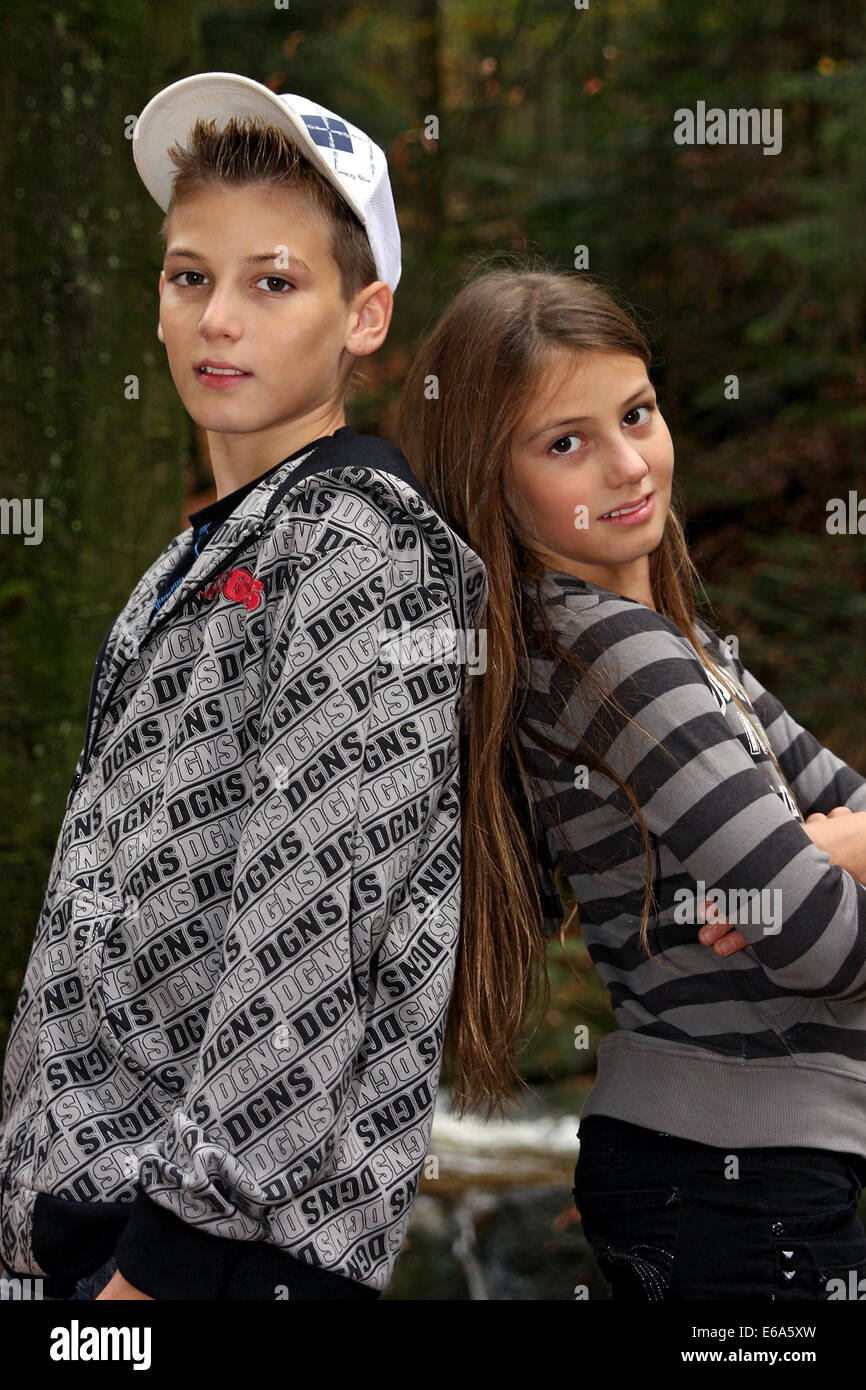 Sisters Back Back Arms Crossed High Resolution Stock Photography and ...