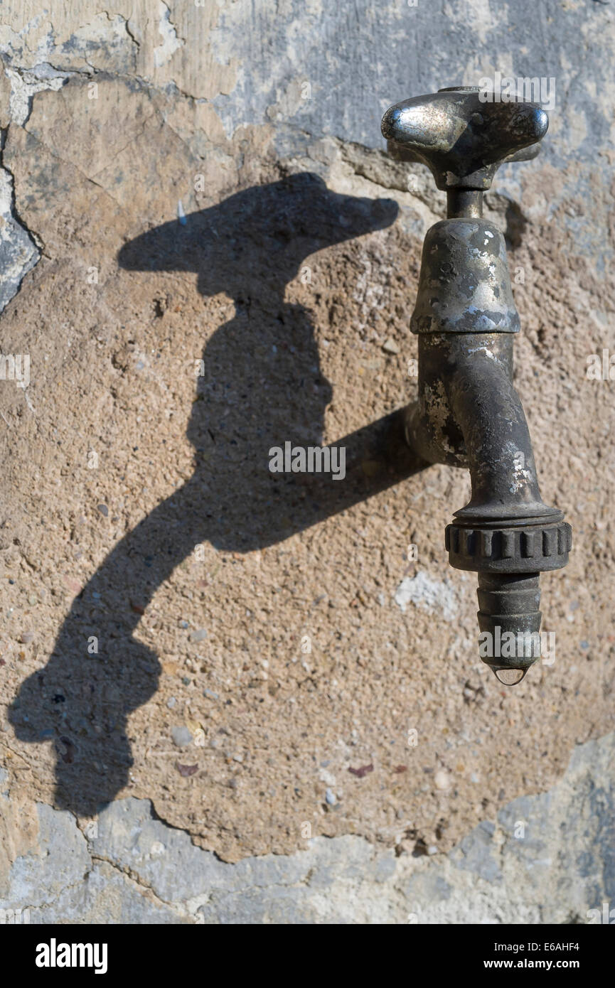 old water tap with drop Stock Photo - Alamy