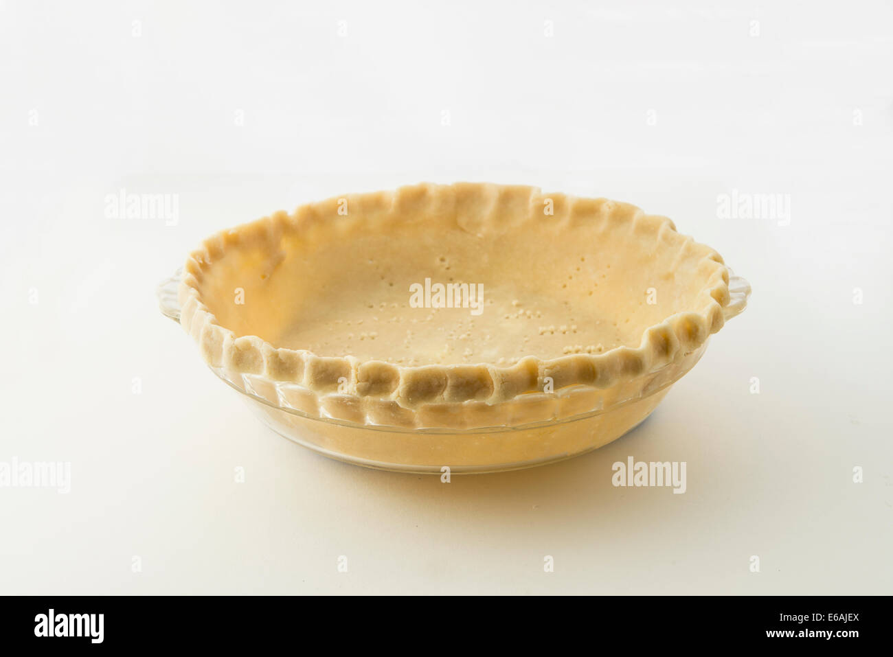 A homemade unbaked pie shell isolated on white. USA. Copyspace Stock ...