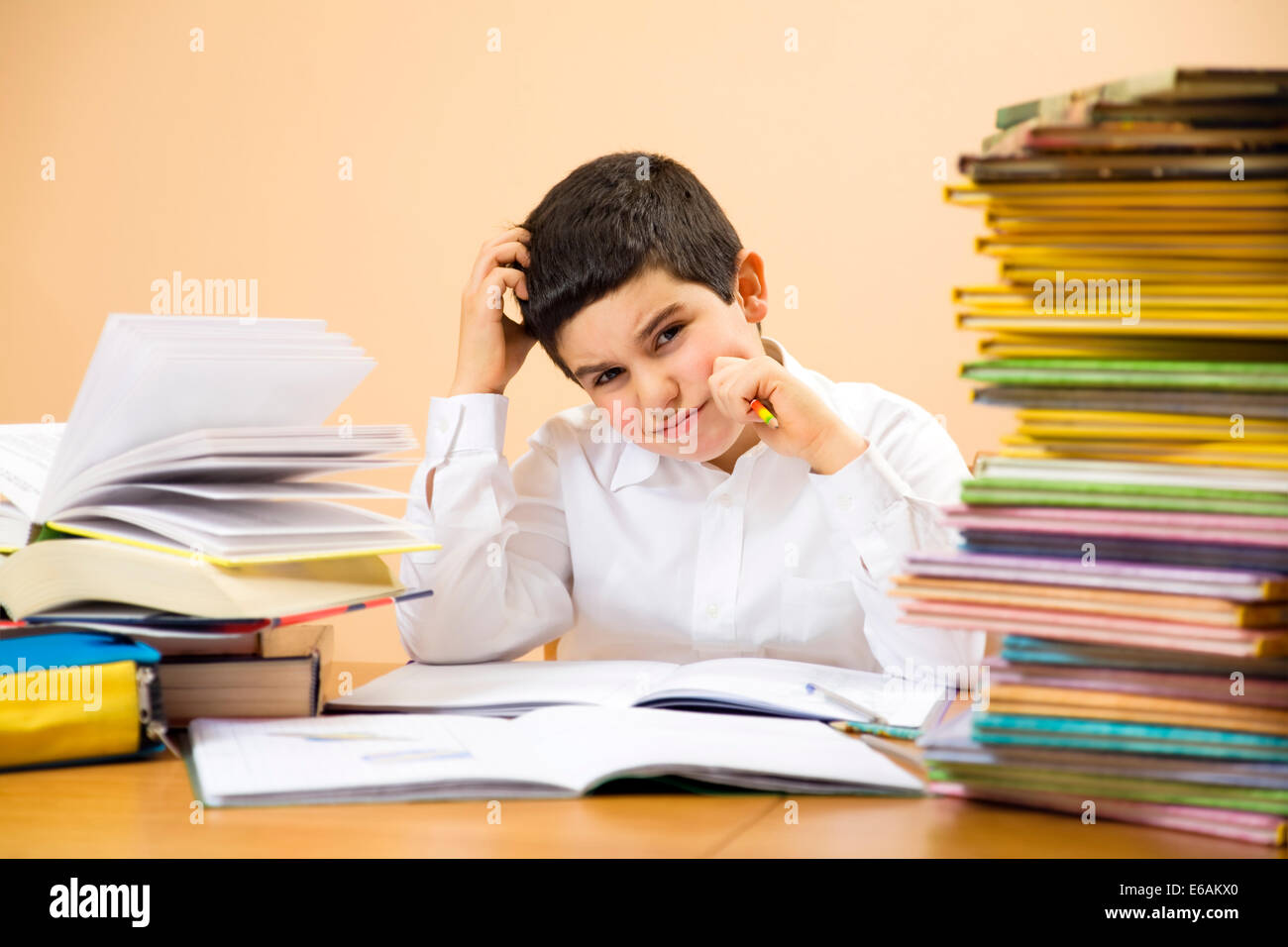 Child leaning over desk hi-res stock photography and images - Alamy