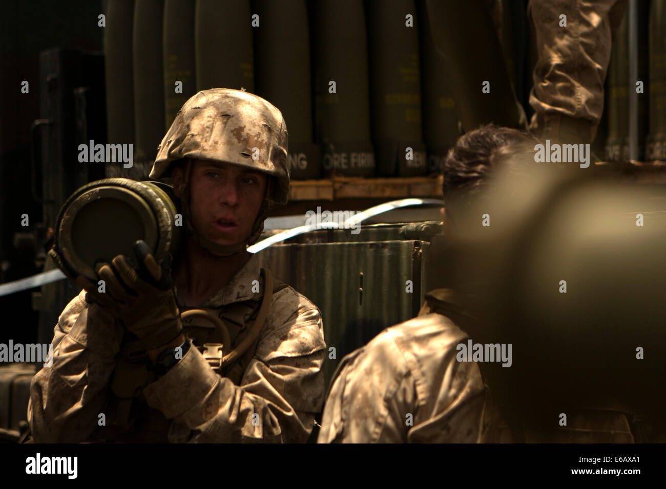 U.S. Marine Corps Lance Cpl. Christopher Hess, a field artillery fire ...
