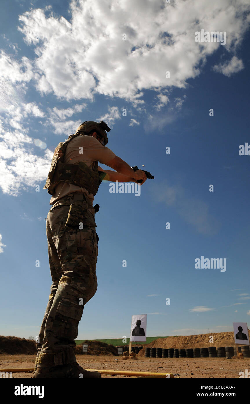 A U.S. Soldier with the 7th Airborne Special Forces Group fires his ...
